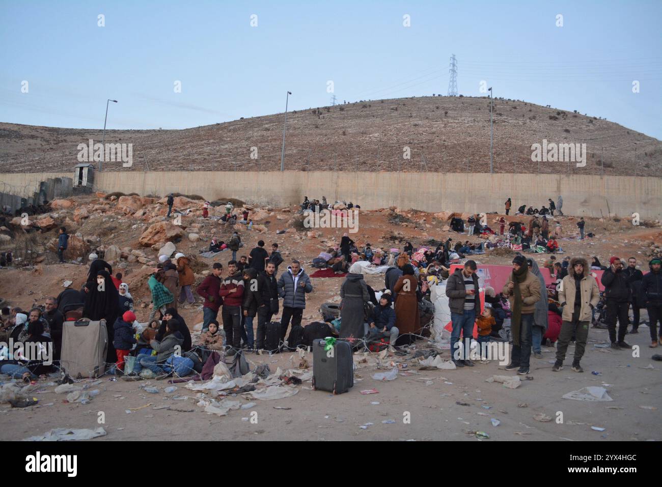 Masnaa. 12th Dec, 2024. Syrians fleeing Syria are stuck at the border ...