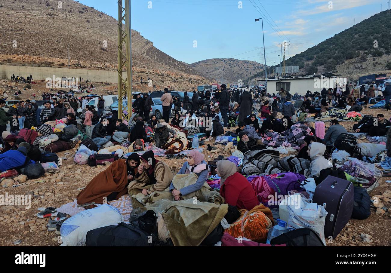 Masnaa. 12th Dec, 2024. Syrians fleeing Syria are stuck at the border ...