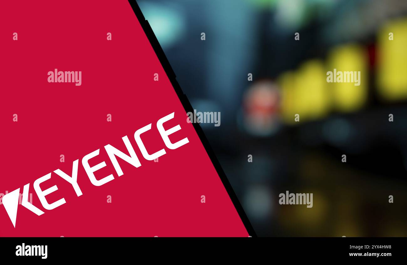 Keyence logo is displayed on smartphone. Keyence is a Japanese company ...