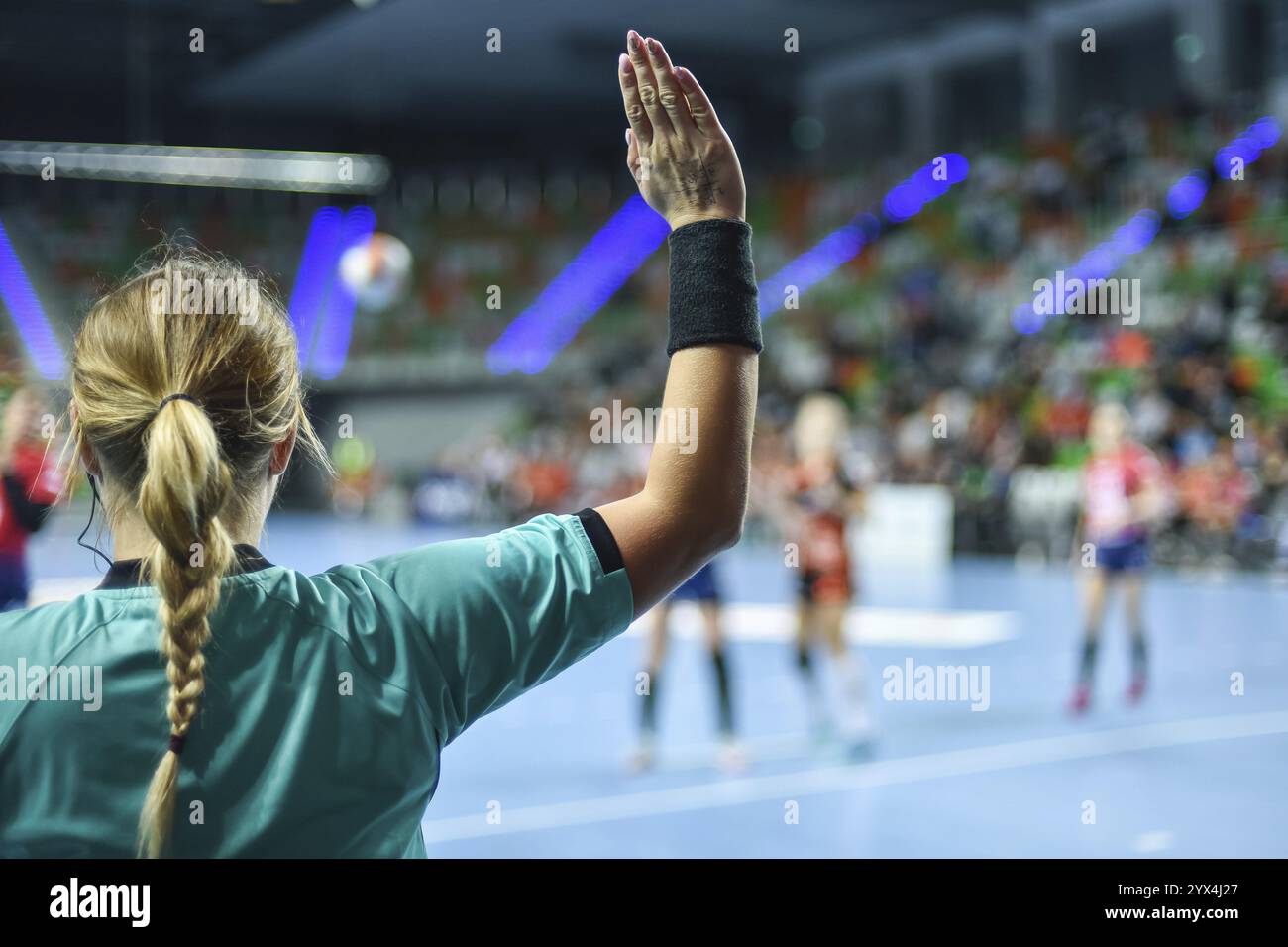 Handball referee gives signal playing for time during handball match ...