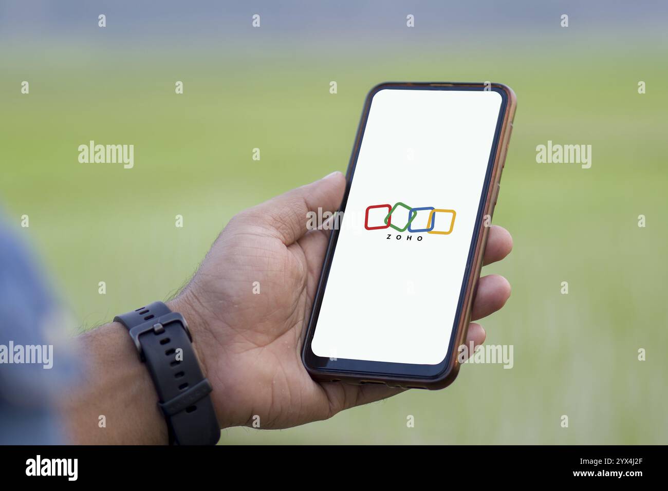 ZOHO Logo on Smartphone Screen Stock Photo - Alamy