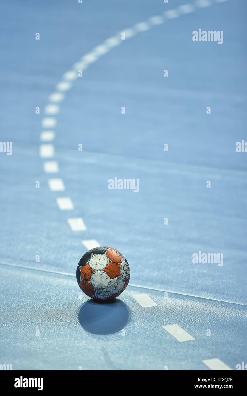 Handball - a ball laying on the 9 meters dotted line Stock Photo - Alamy