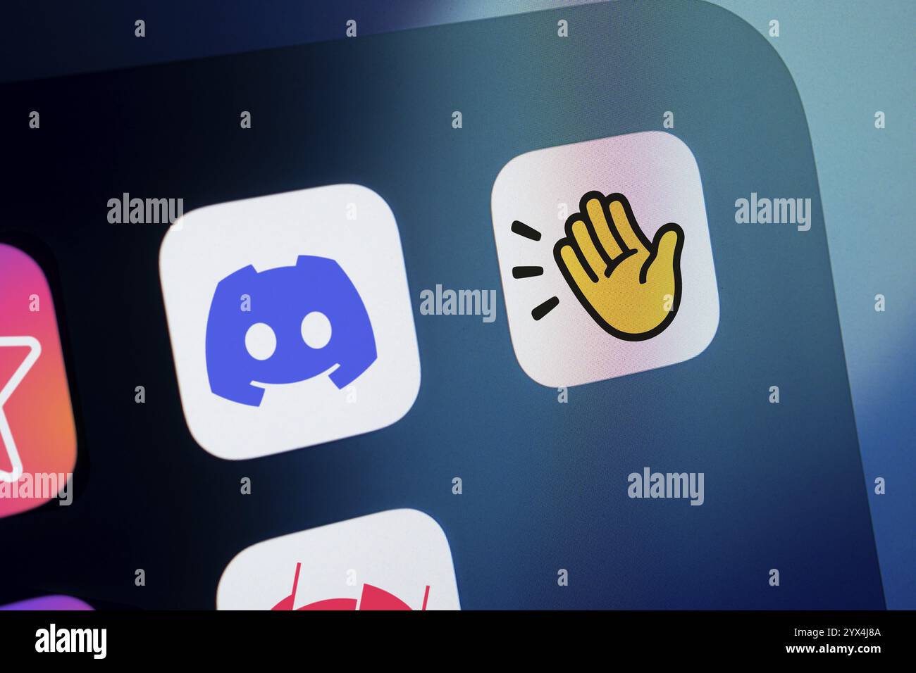 A close up of an smartphone screen displaying the clubhouse app icon ...