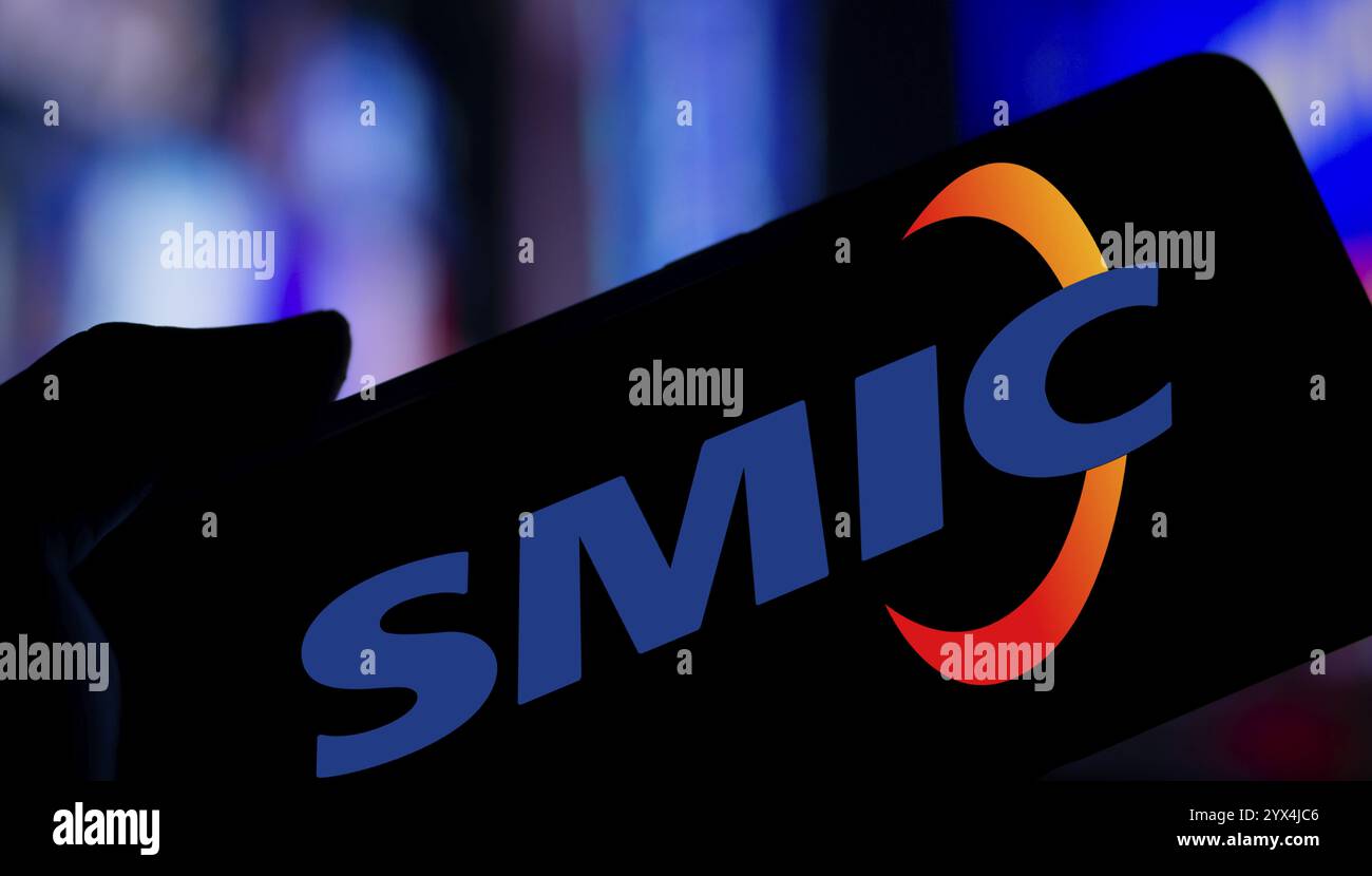 SMIC logo is displayed on smartphone. Semiconductor Manufacturing ...
