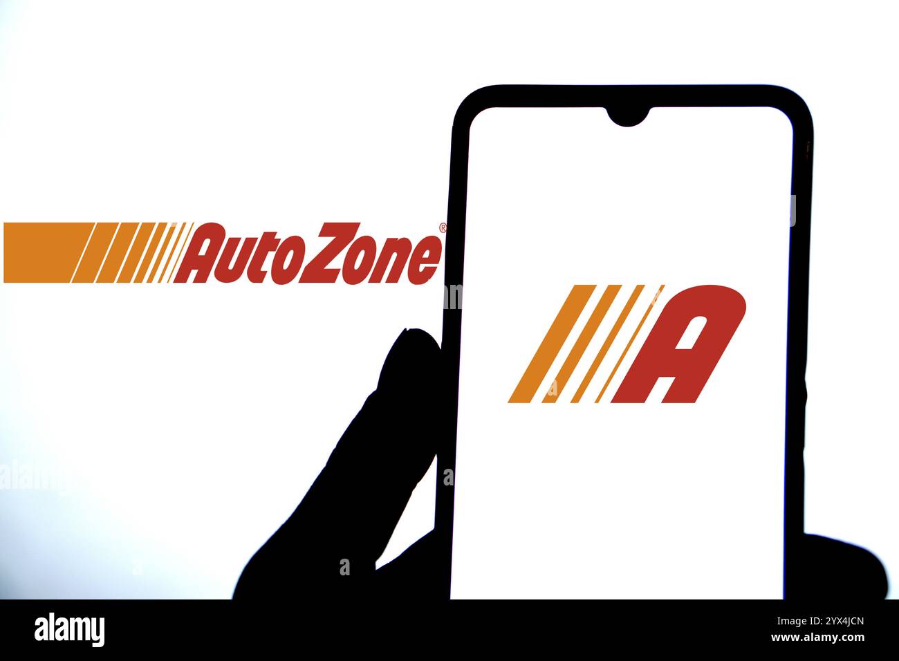 AutoZone logo on man handset Stock Photo - Alamy