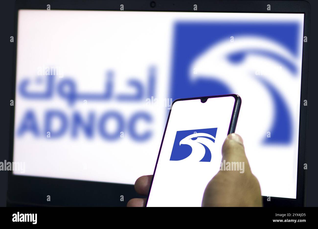Abu Dhabi National Oil Company (ADNOC) on smartphone Stock Photo - Alamy