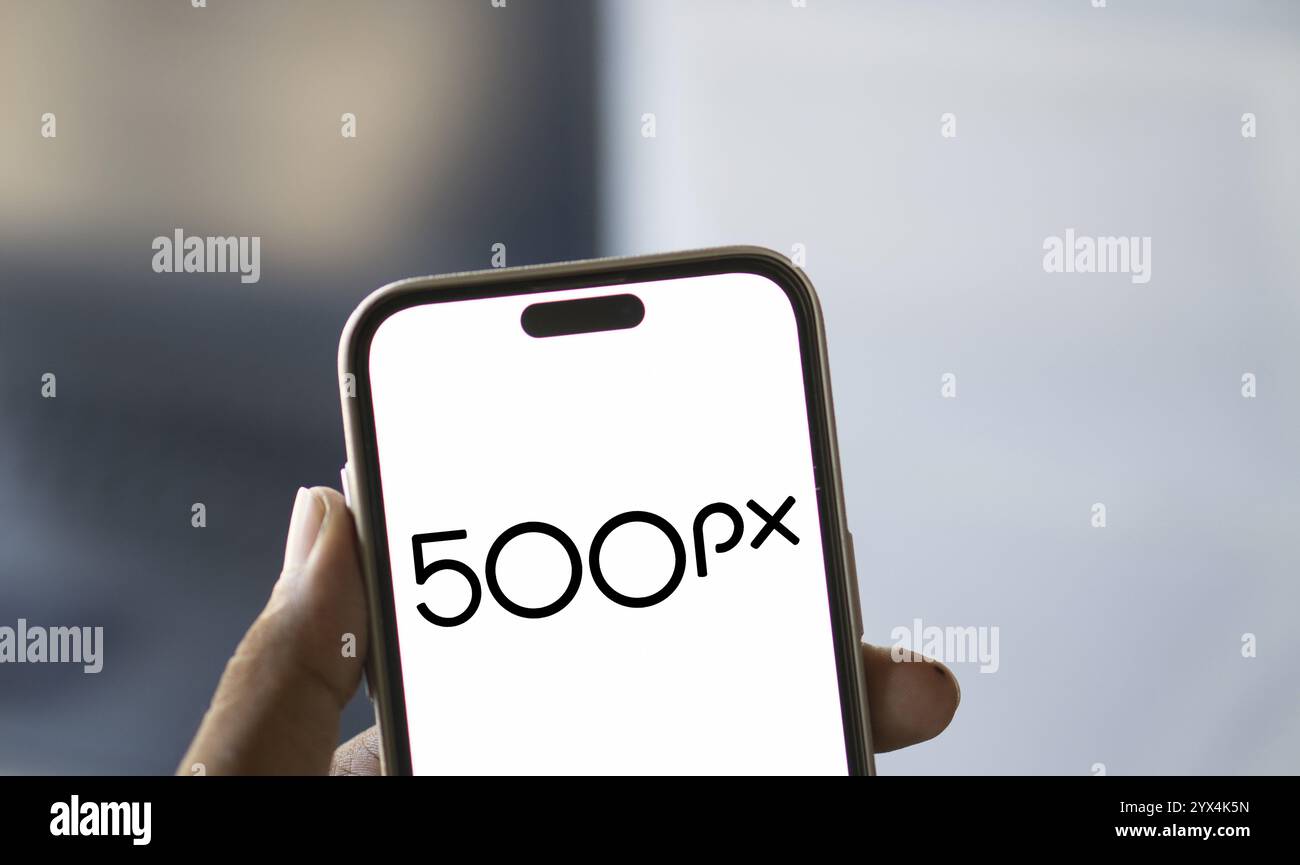 500px logo is displayed on smartphone.500px is a global online photo ...