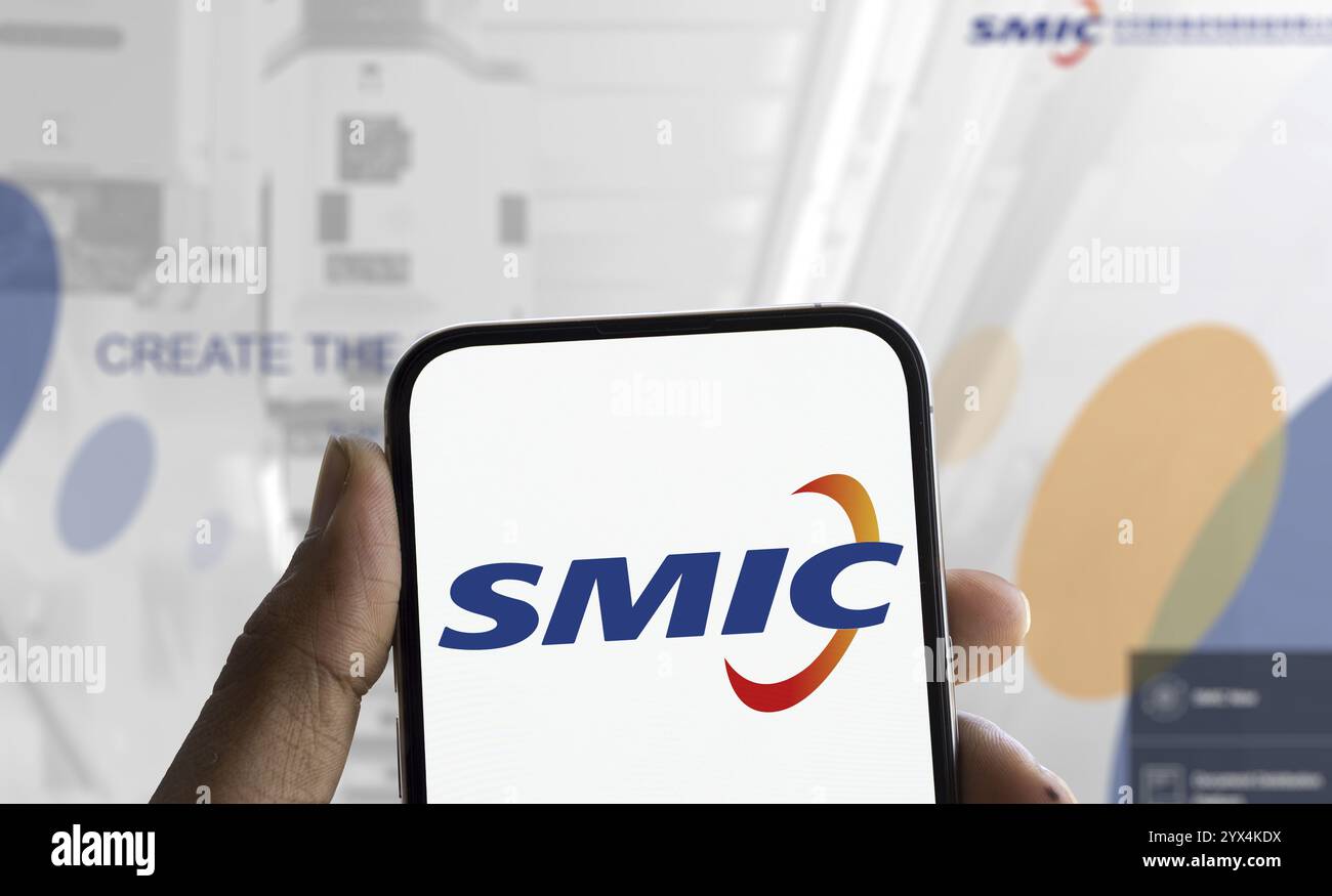 SMIC logo is displayed on smartphone. Semiconductor Manufacturing ...