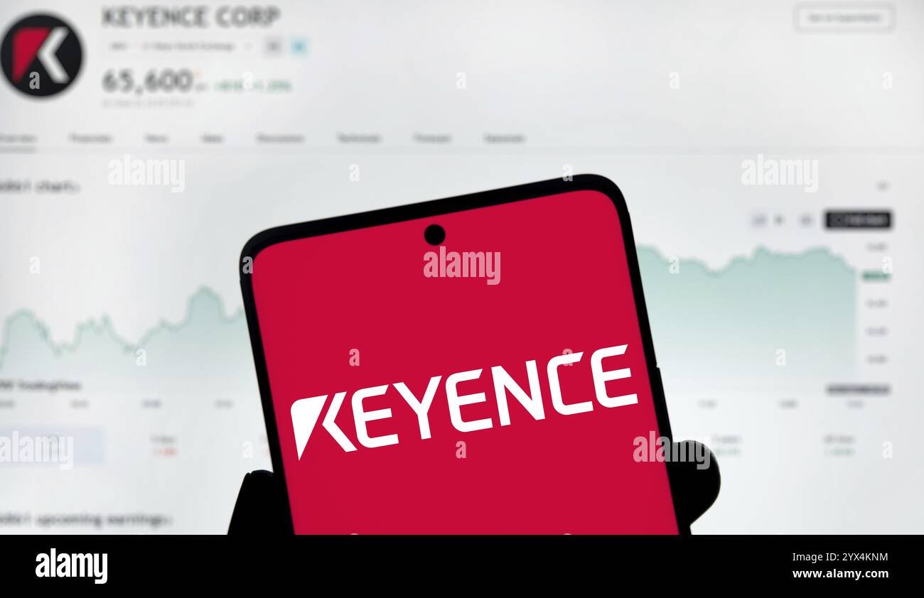 Keyence logo is displayed on smartphone. Keyence is a Japanese company ...