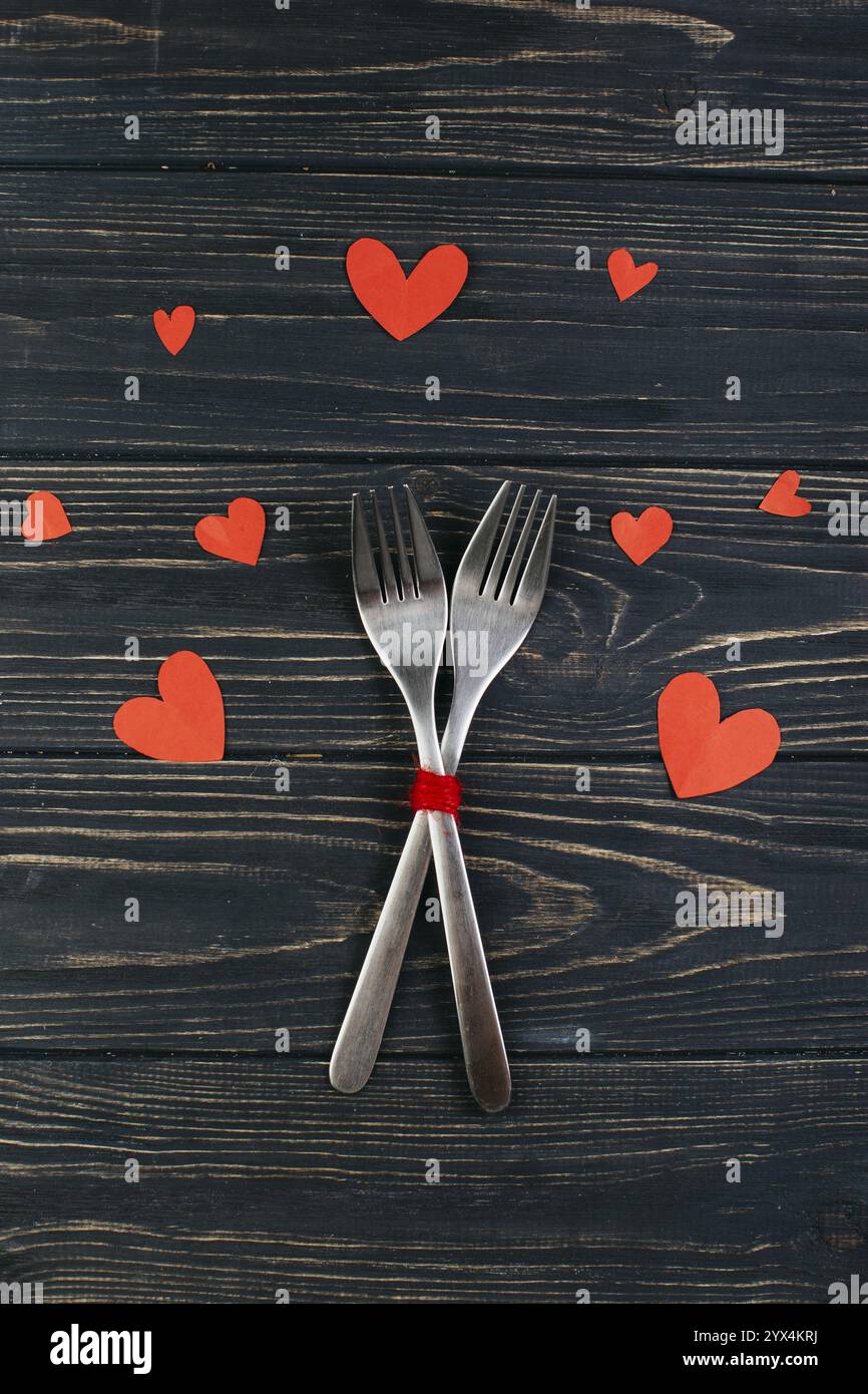 Two forks with paper hearts Stock Photo - Alamy