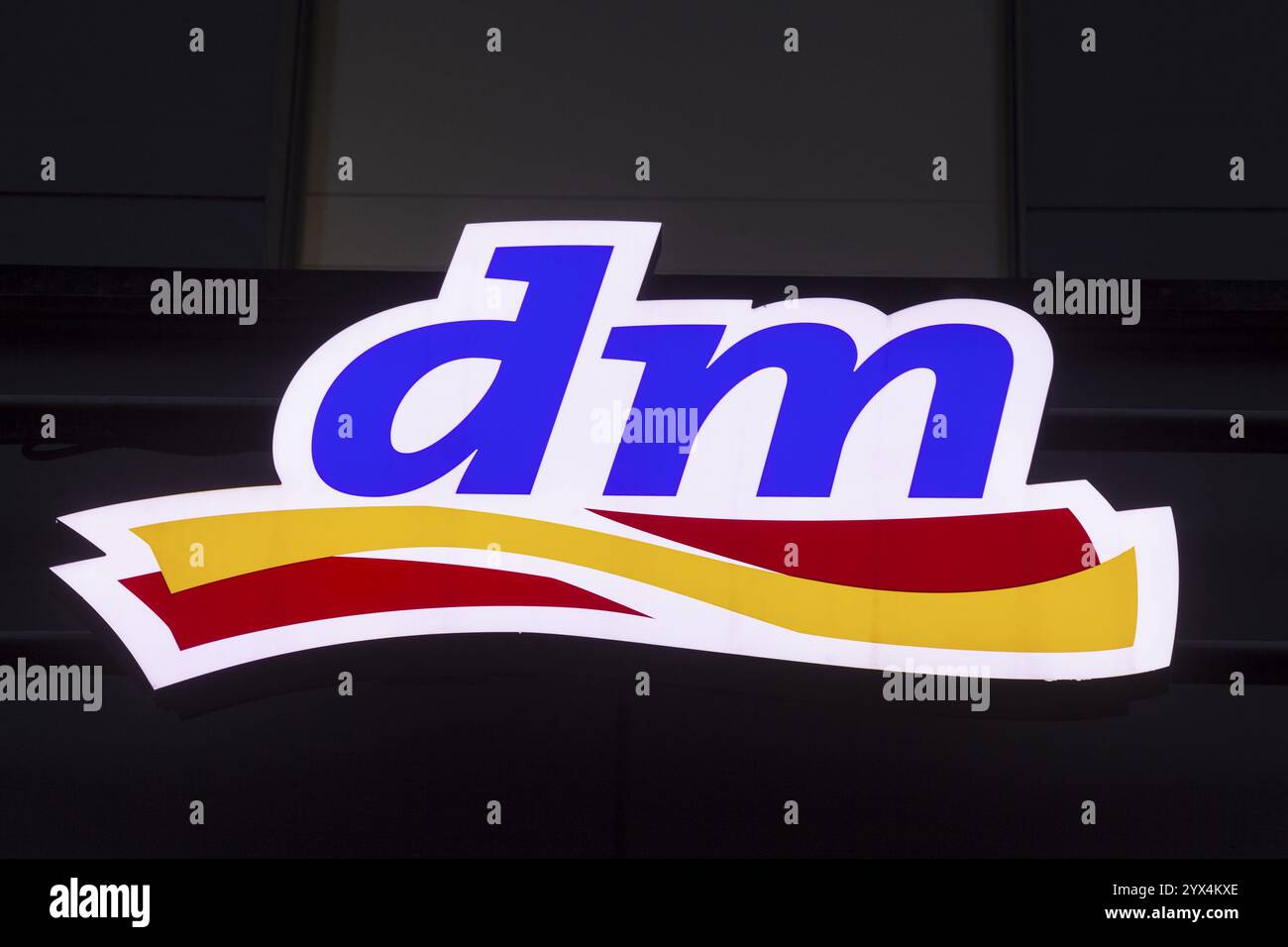 Logo, drugstore discounter DM at night with black background, Germany ...