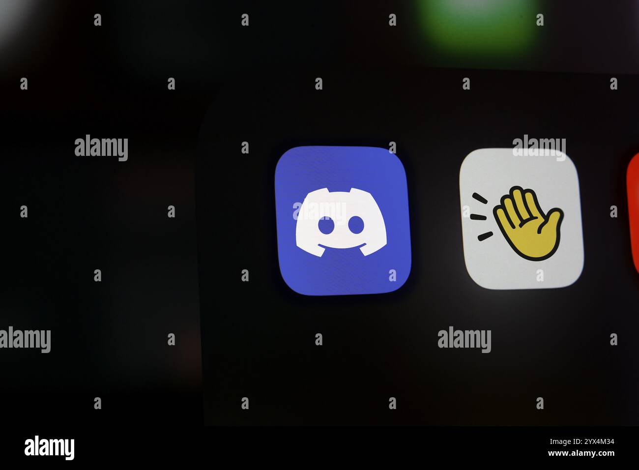 A close up of an smartphone screen displaying the clubhouse app icon ...