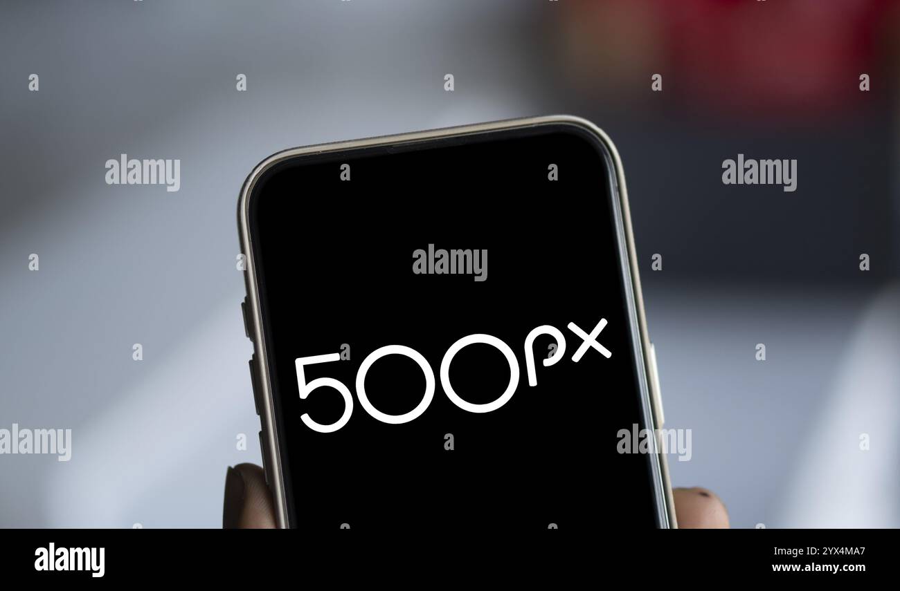 500px logo is displayed on smartphone.500px is a global online photo ...