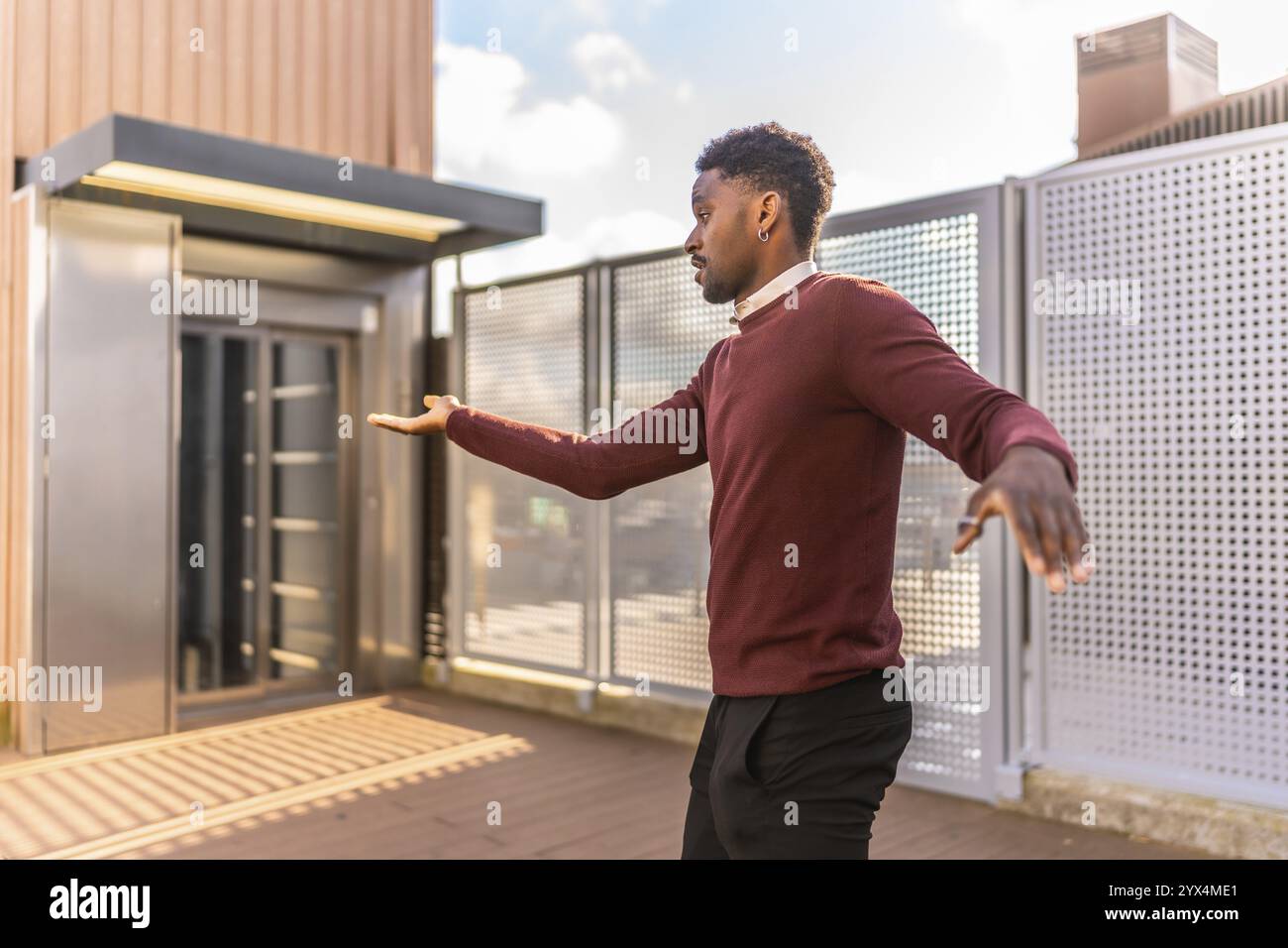 Side view of a cool african man dancing urban style in the city Stock ...