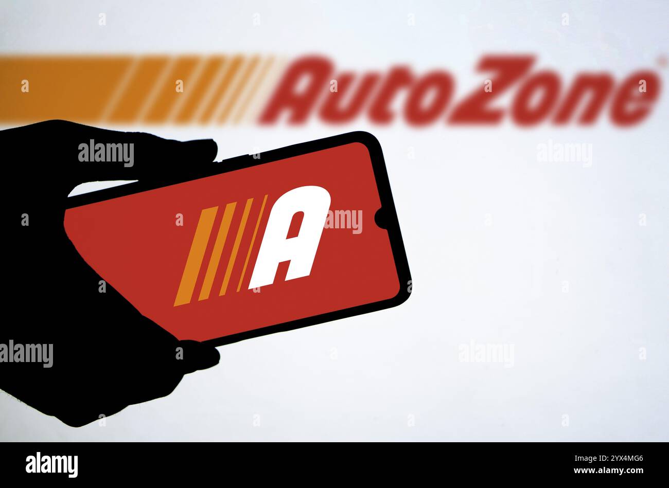 AutoZone logo on man handset Stock Photo - Alamy