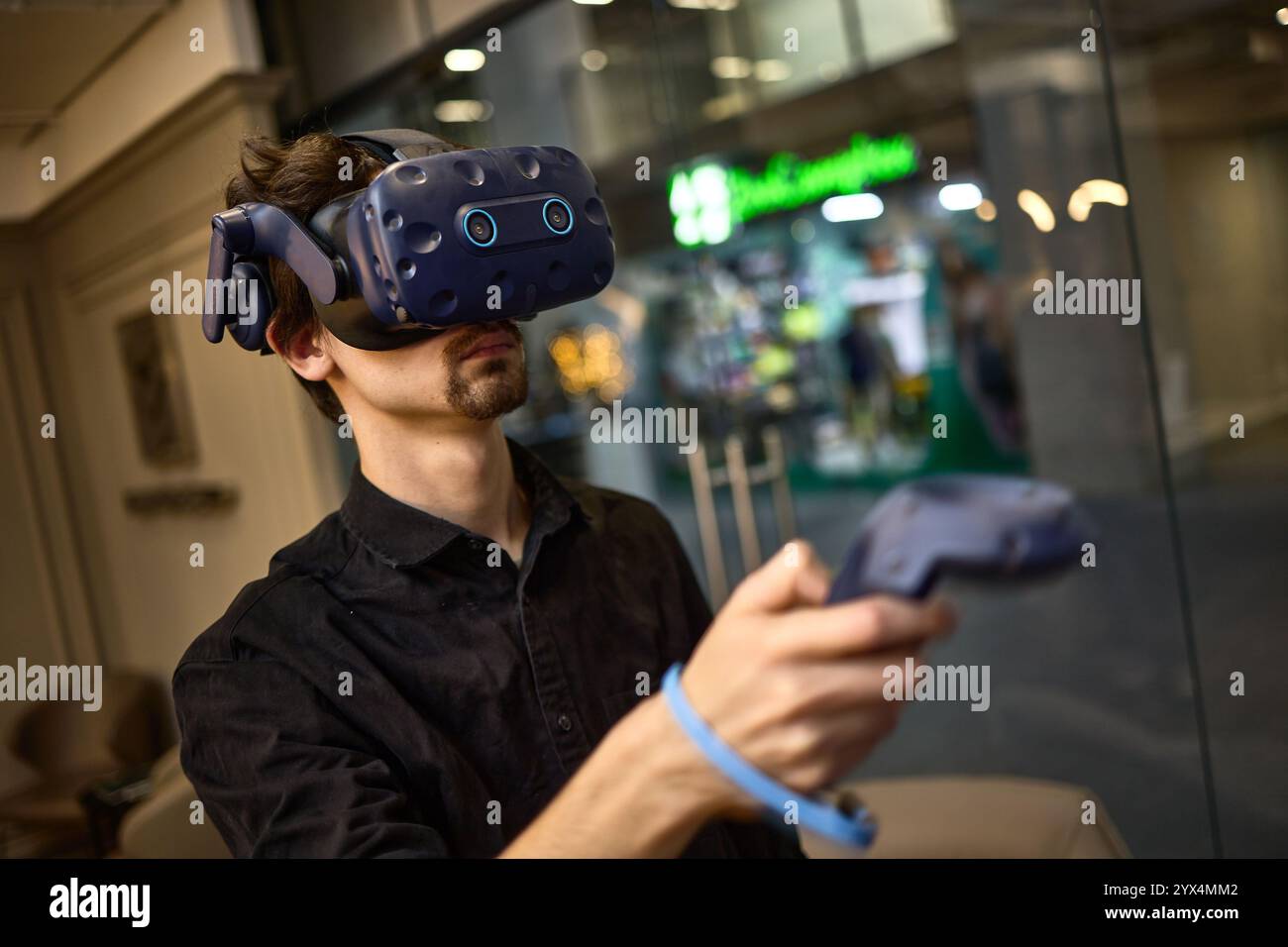 Individual in a virtual reality headset in a contemporary setting ...