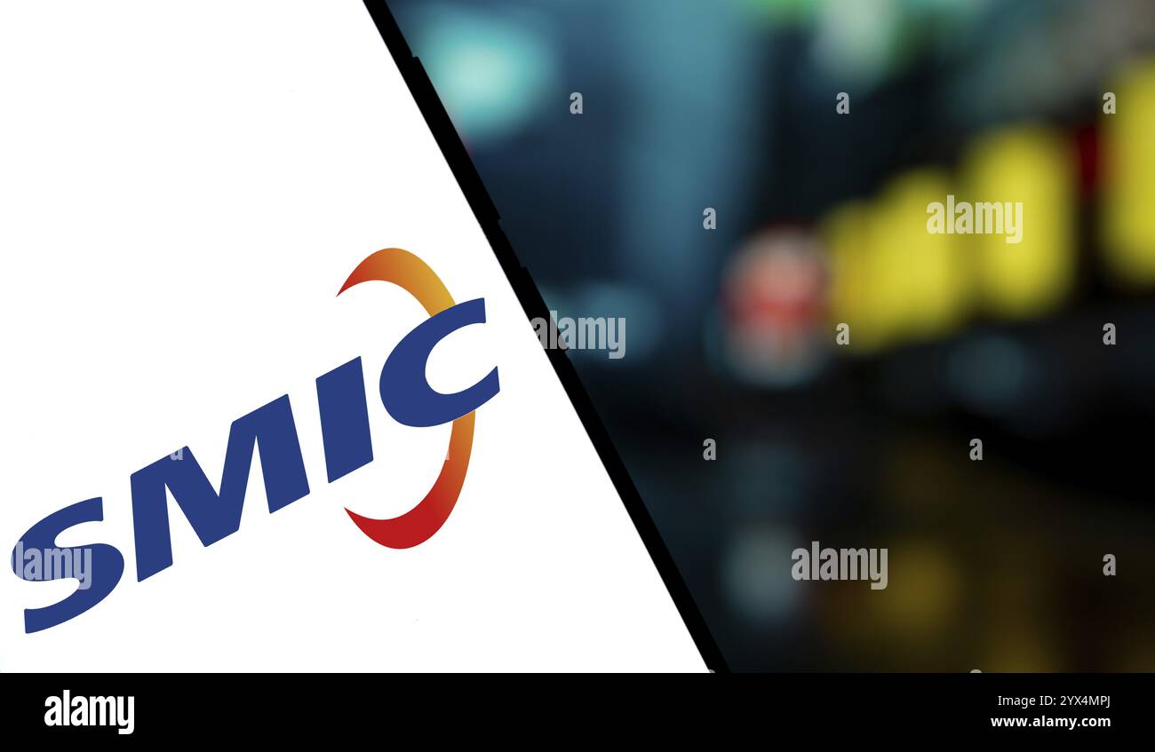SMIC logo is displayed on smartphone. Semiconductor Manufacturing ...