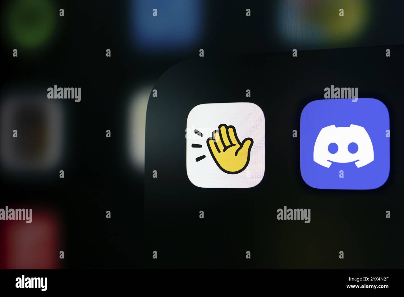 A close up of an smartphone screen displaying the clubhouse app icon ...