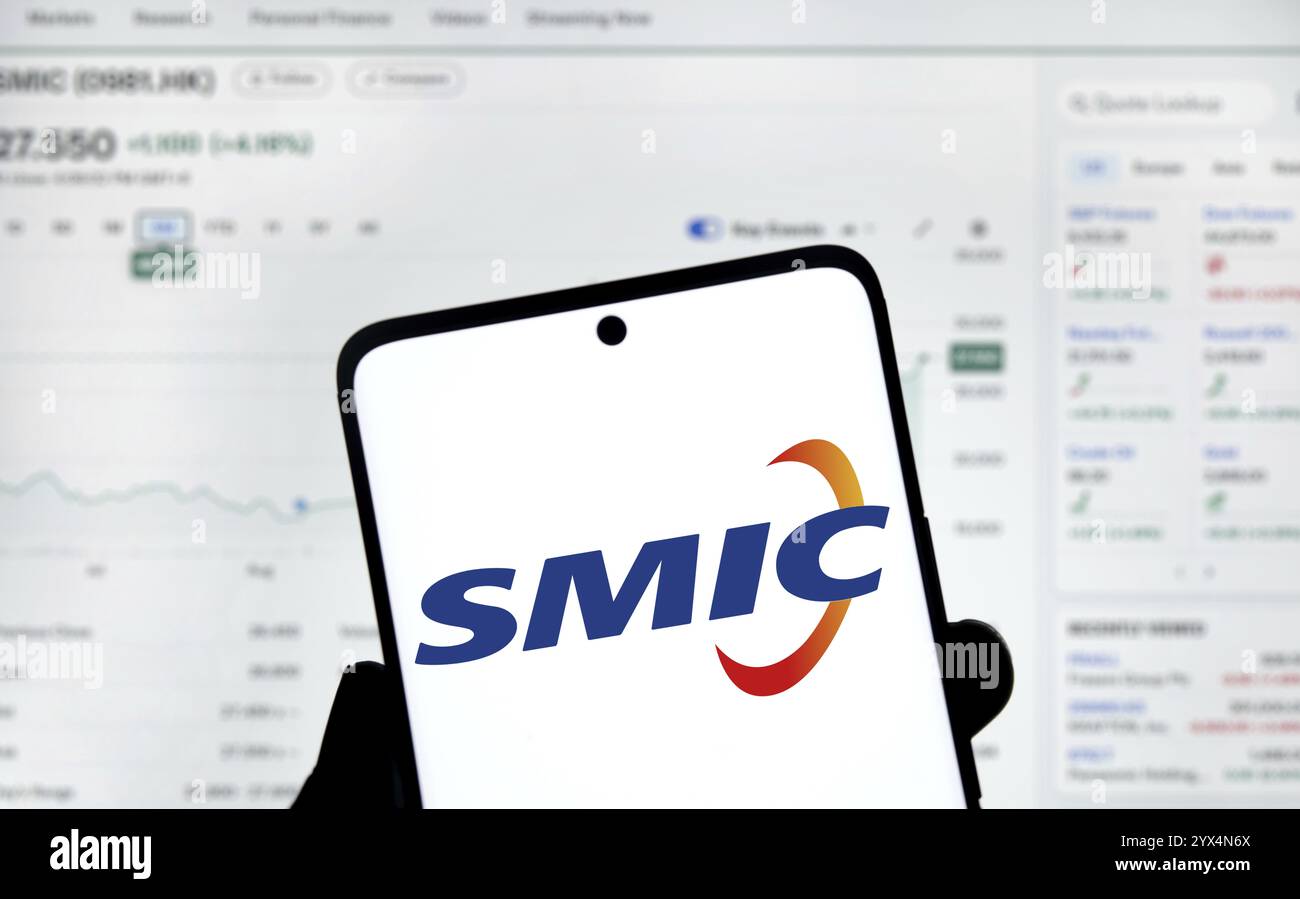 SMIC logo is displayed on smartphone. Semiconductor Manufacturing International Corporation is a ...
