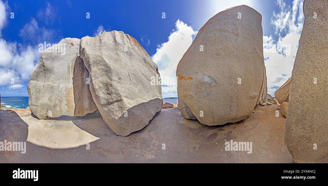 View through remarkable rock formations framing blue ocean under a ...