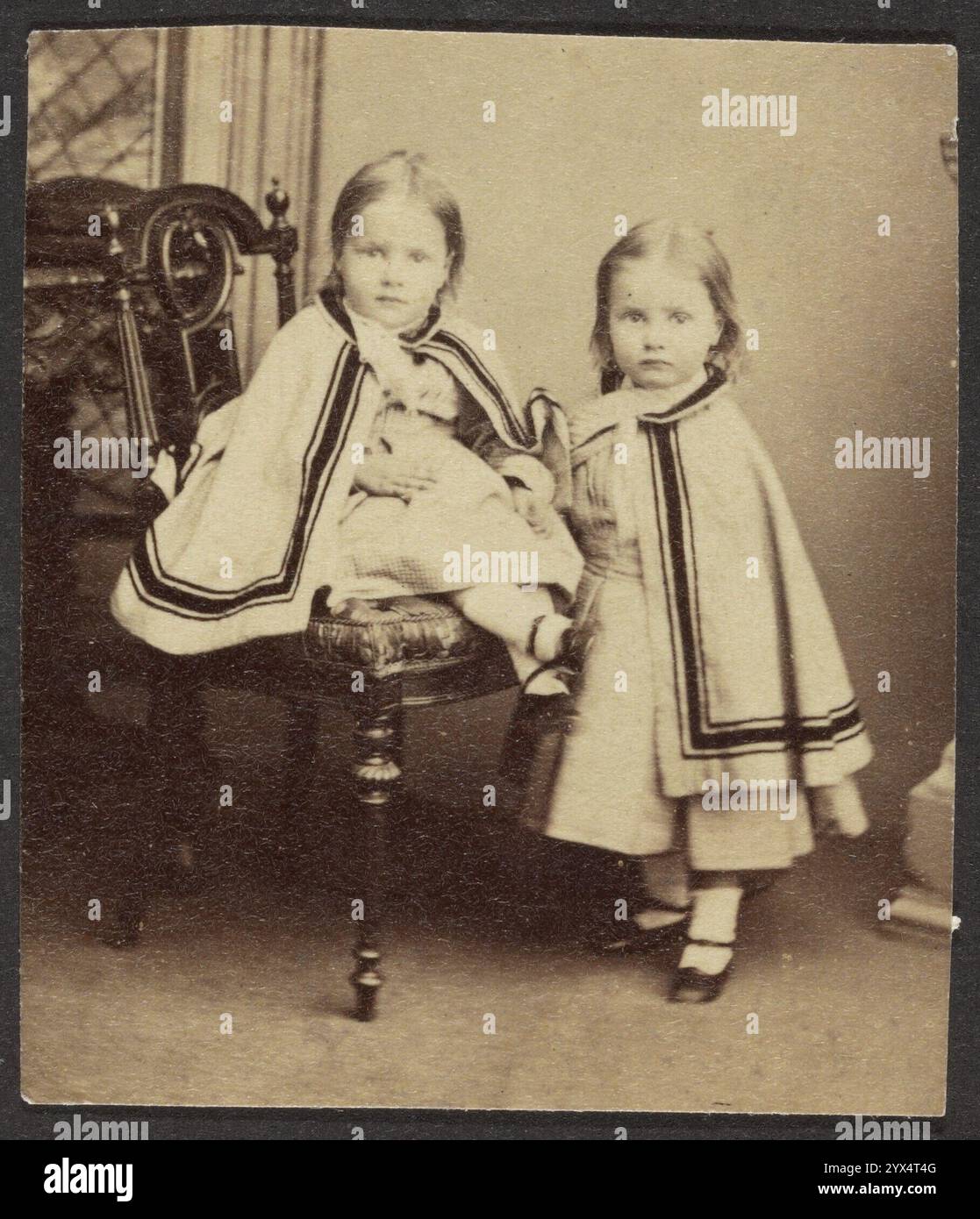 Portrait of Two Girls in Matching Capes, late 19th century. Additional ...