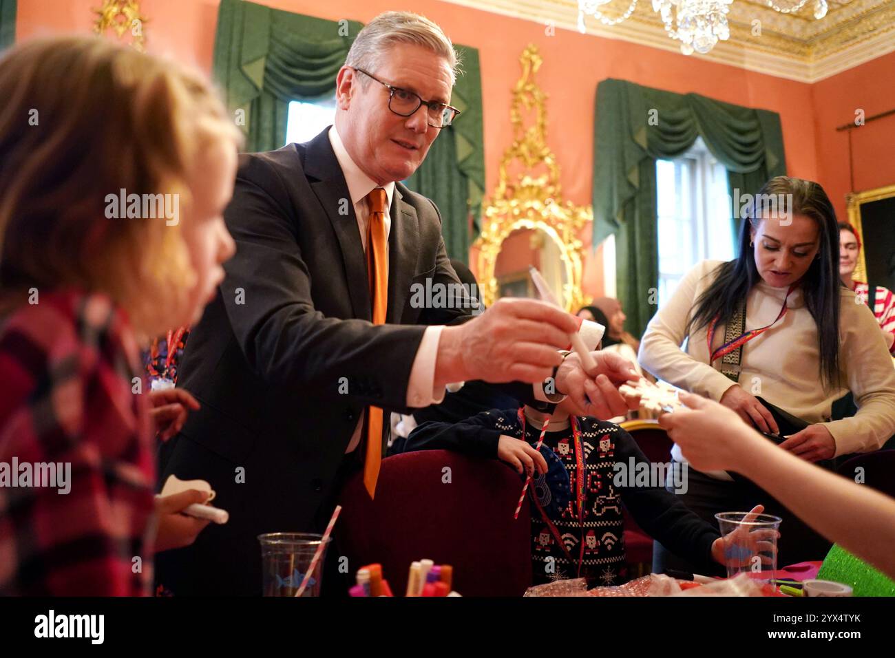 Prime Minister Sir Keir Starmer interacts with children as he and his ...