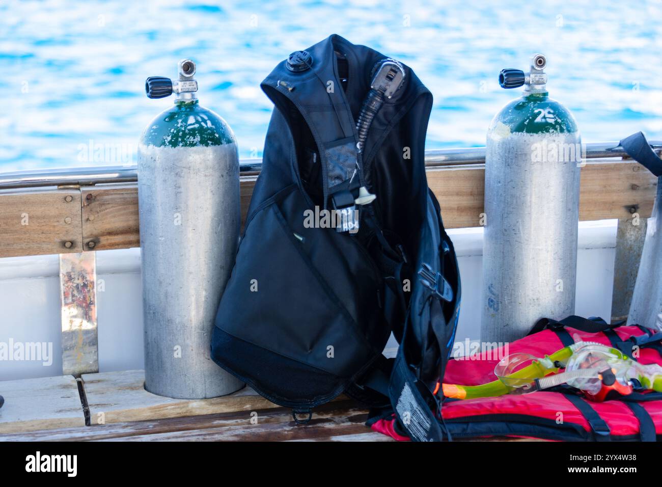 Concept of scuba diving with tank and equipment lying on a boat over ...