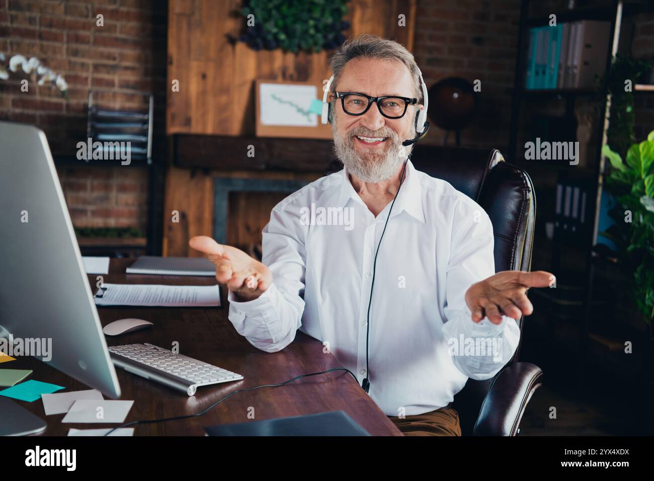Photo of handsome mature man walking welcome call center wear white ...
