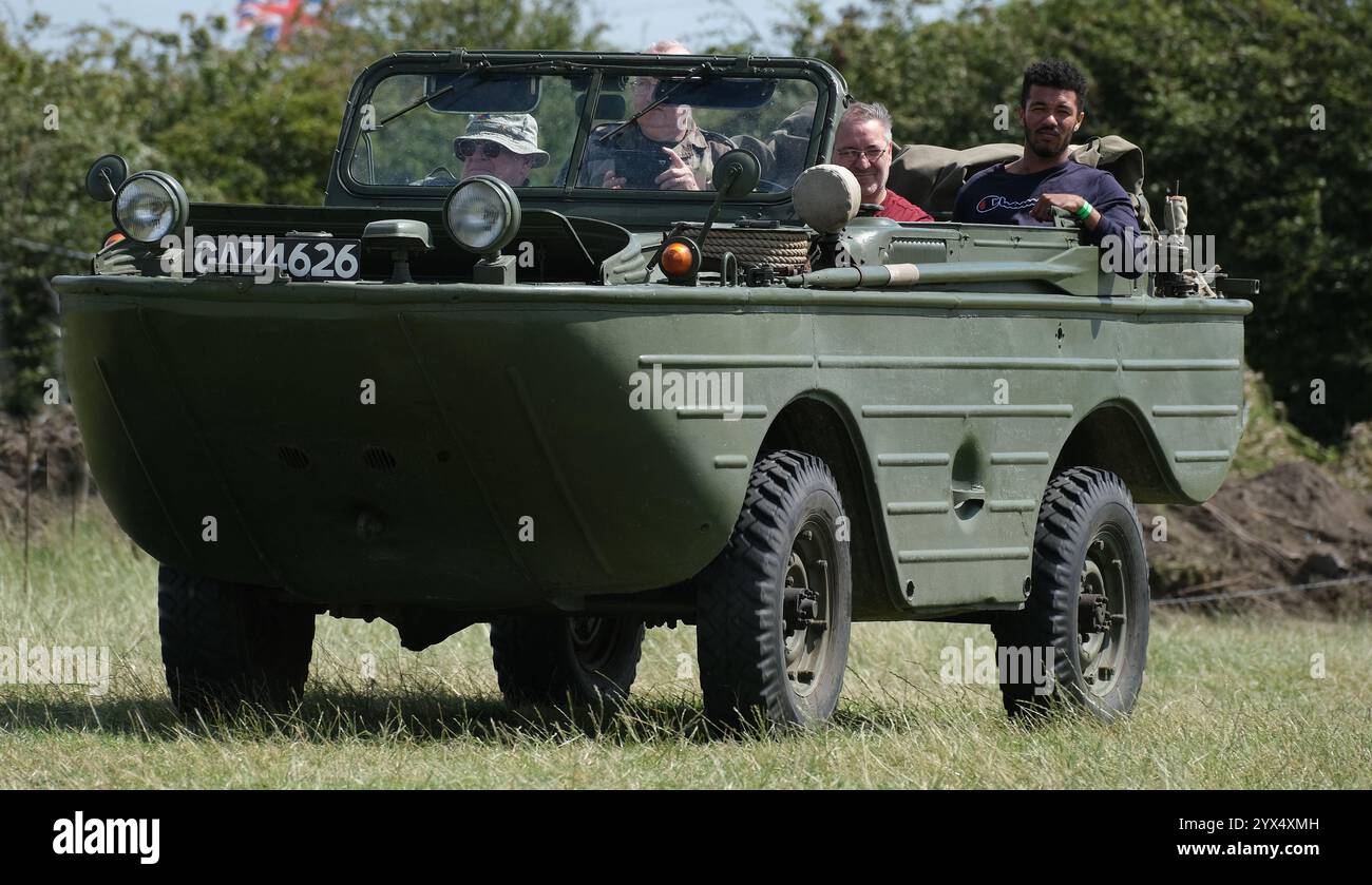 The DUKW is a six-wheel-drive amphibious modification of the 2+1⁄2-ton ...