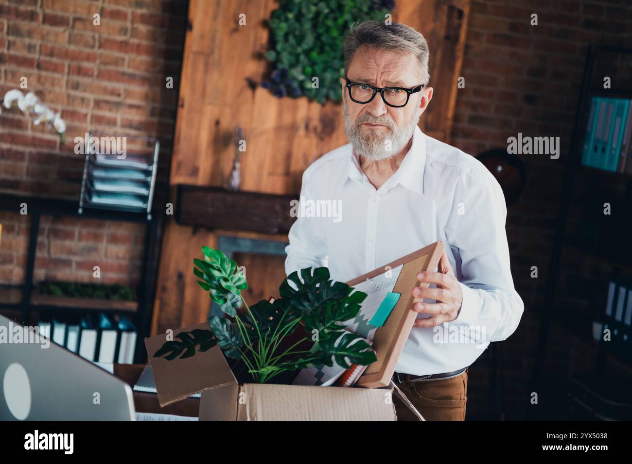 Photo of handsome mature man fired carton box wear white shirt ...