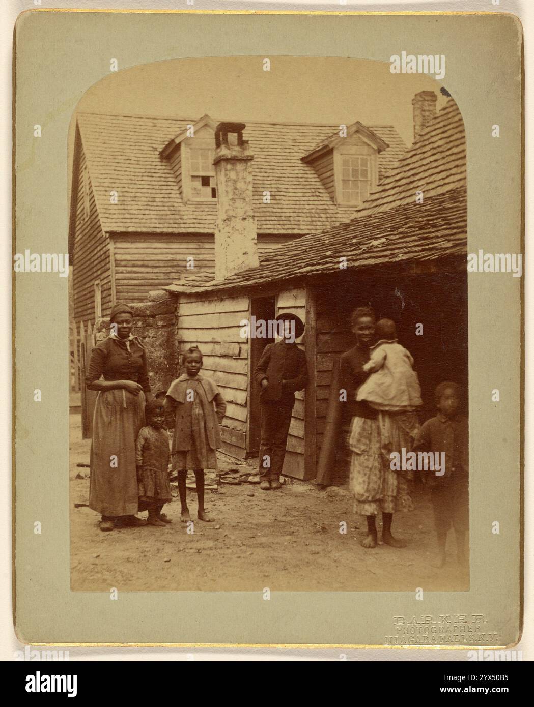 Portrait of a Black family standing in front of a house, 1886 Stock ...