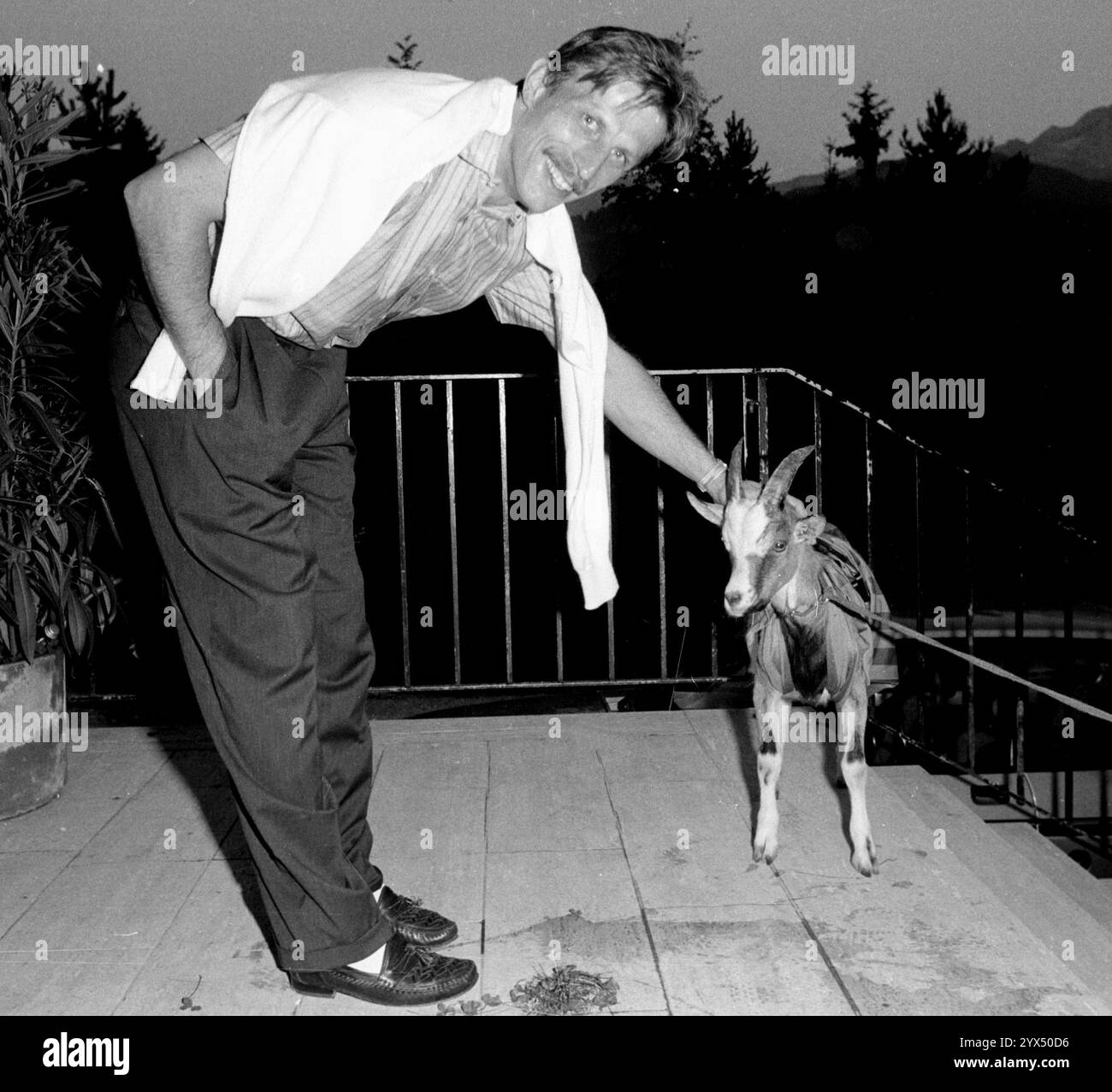Coach Christoph Daum (1. FC Koeln) with a billy goat at the training ...