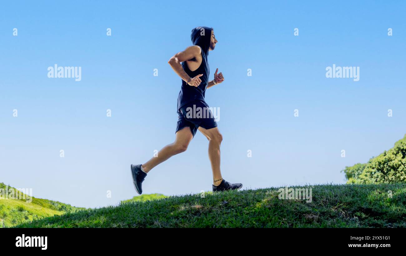 Man jogging through a park hi-res stock photography and images - Alamy