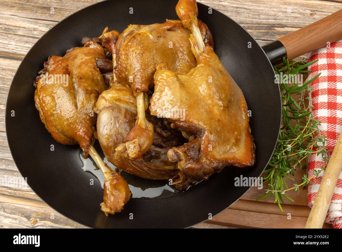 duck legs confit, cooking in a pan Stock Photo - Alamy