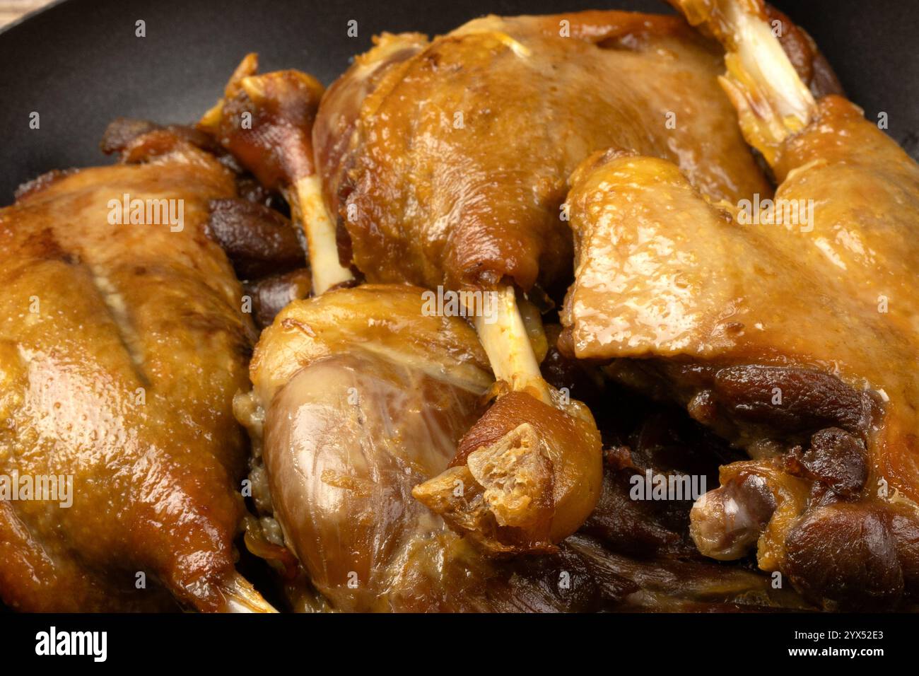duck legs confit, cooking in a pan Stock Photo - Alamy