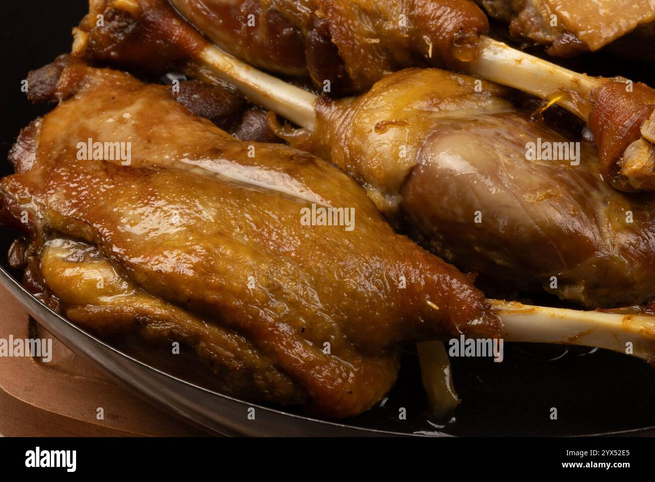duck legs confit, cooking in a pan Stock Photo - Alamy