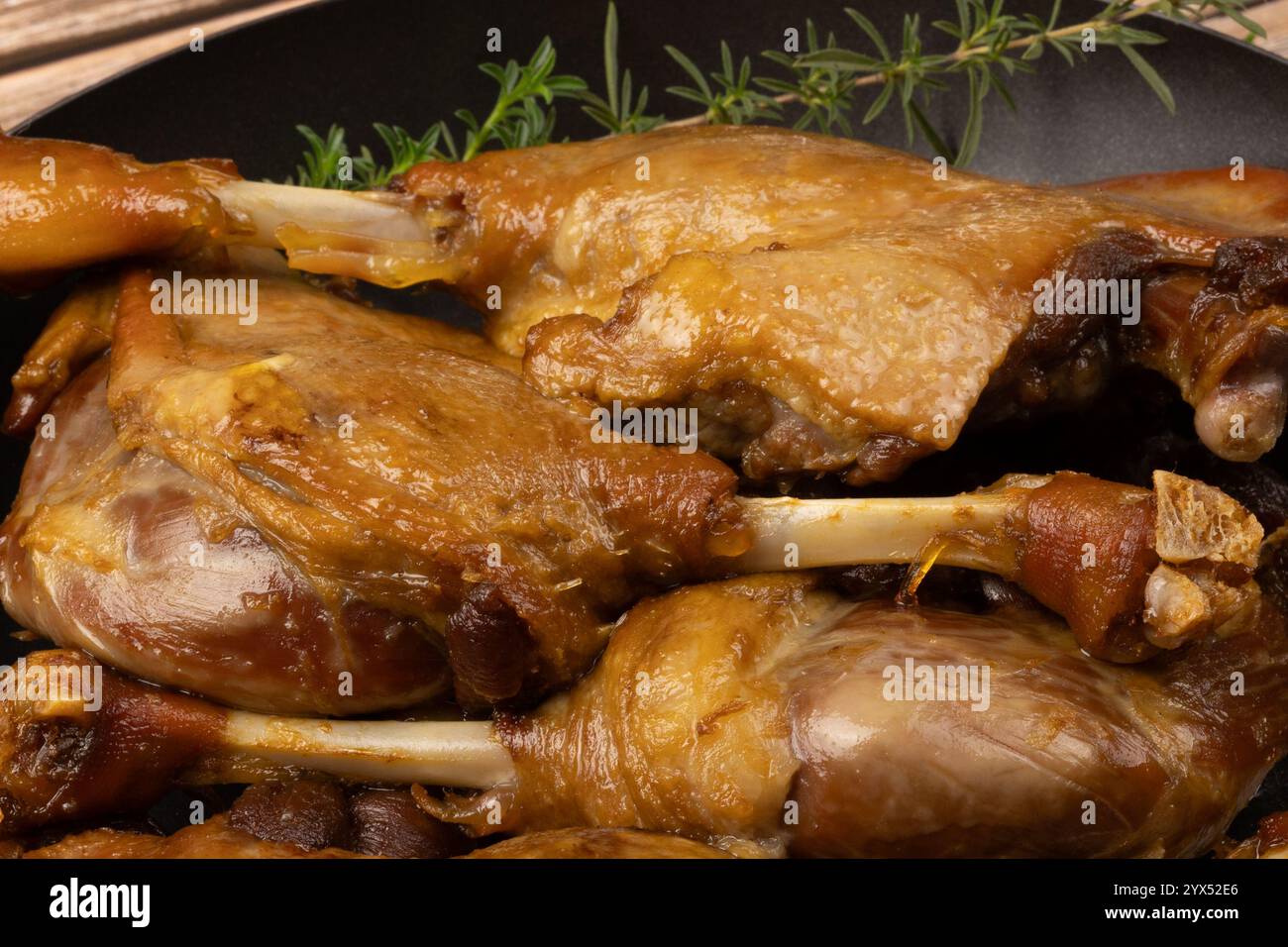 duck legs confit, cooking in a pan Stock Photo - Alamy