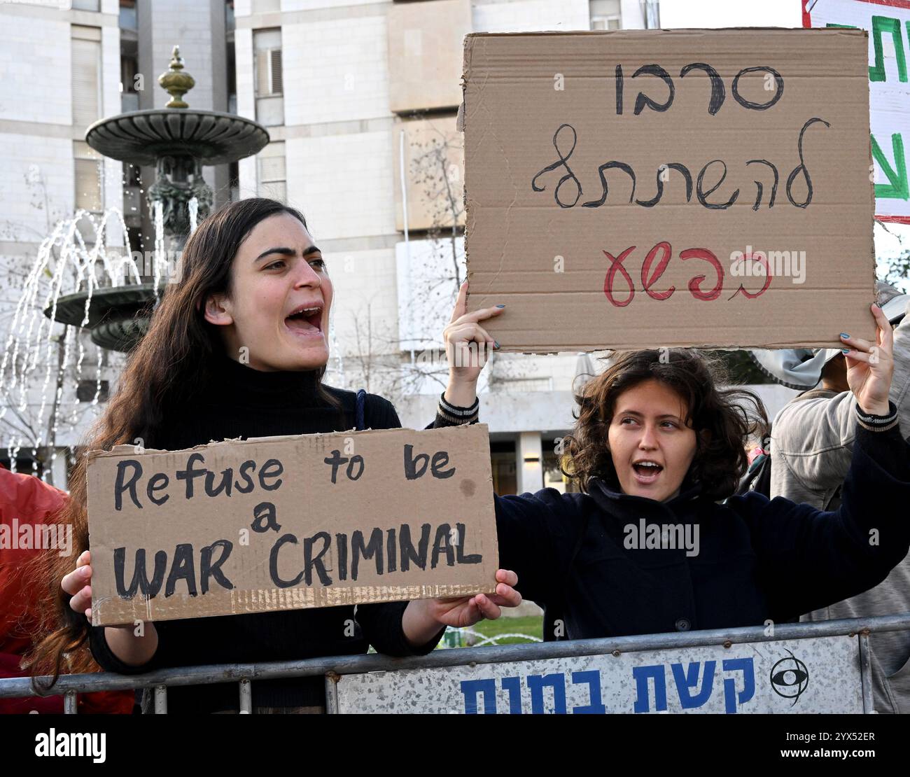 Jerusalem, Israel. 13th Dec, 2024. People hold placards calling for ...