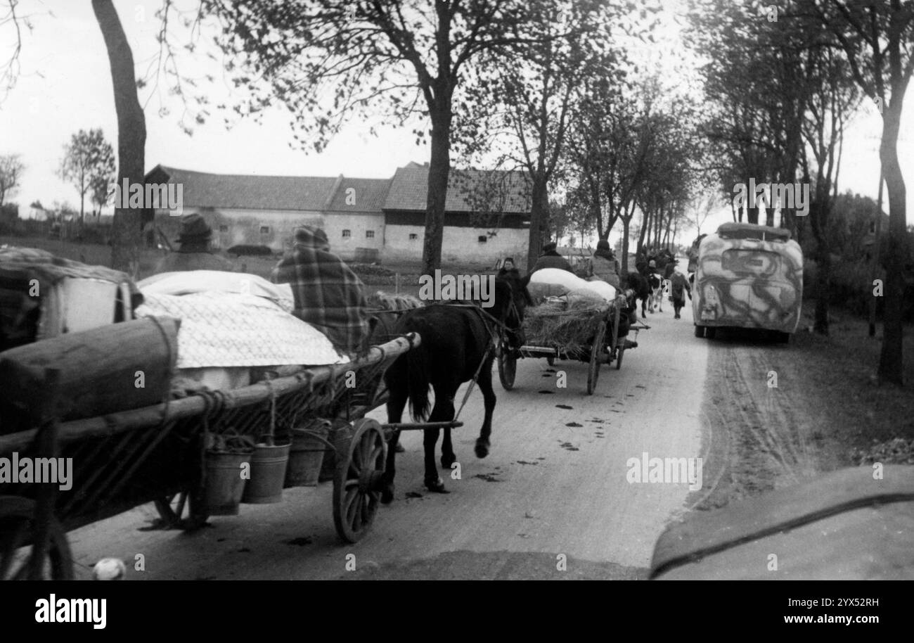 East Prussia in the fall of 1944, a line of Lithuanian refugees heading ...