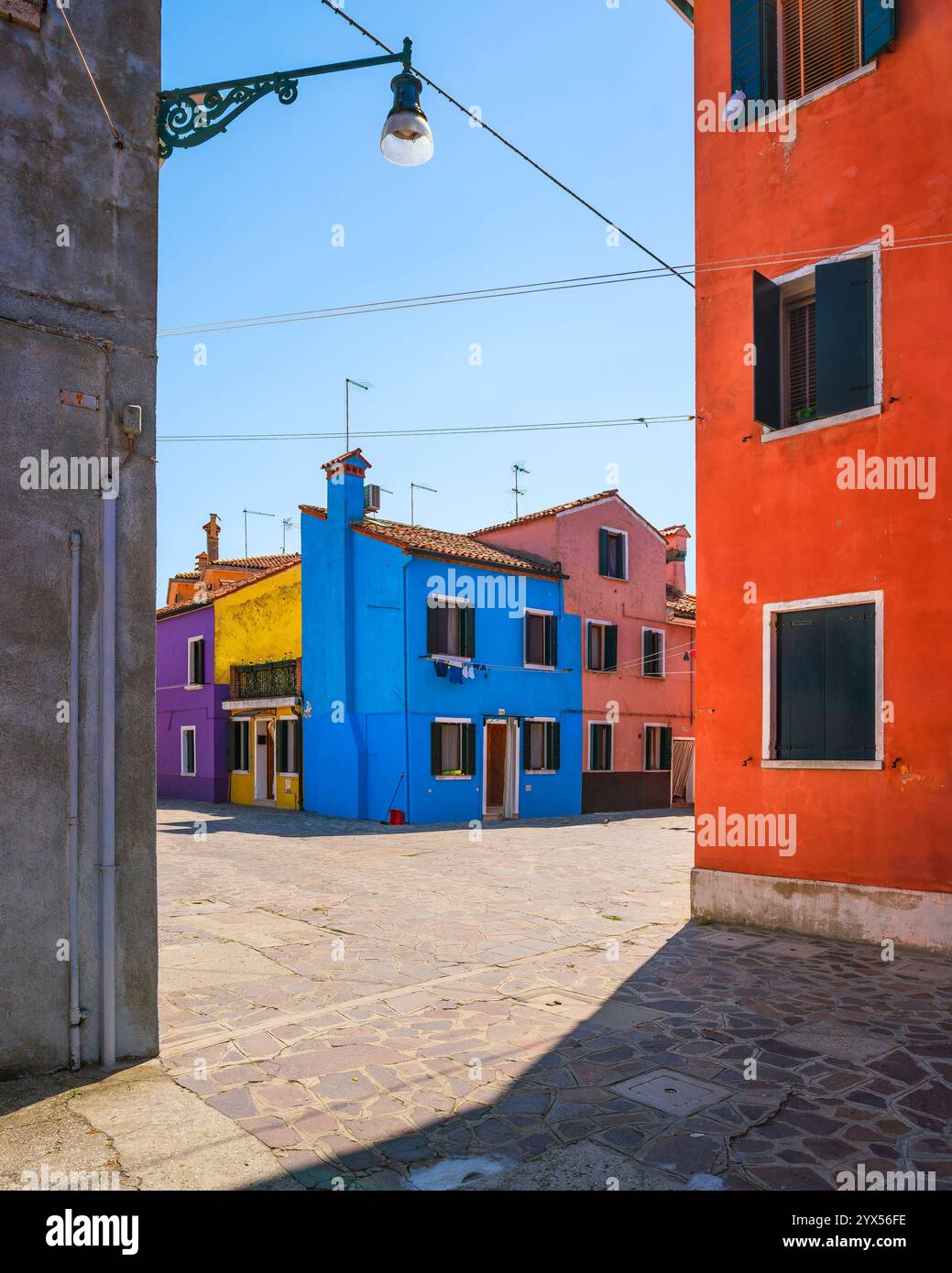 Burano island street, colorful houses in the Venice lagoon. Italy ...