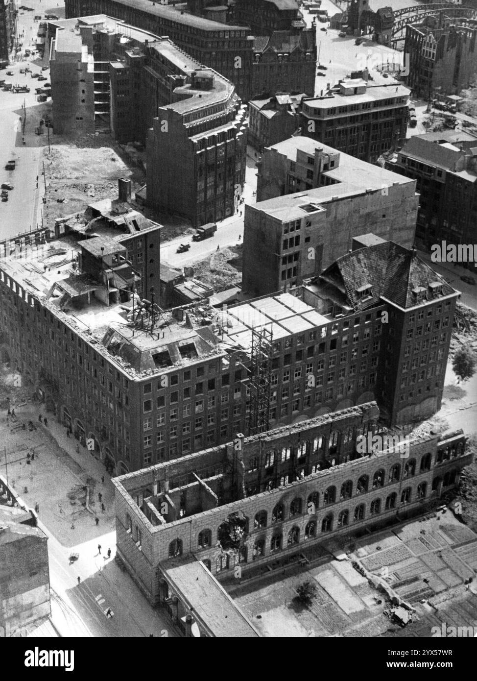 The damaged press building and the ruins of the State Library in front ...