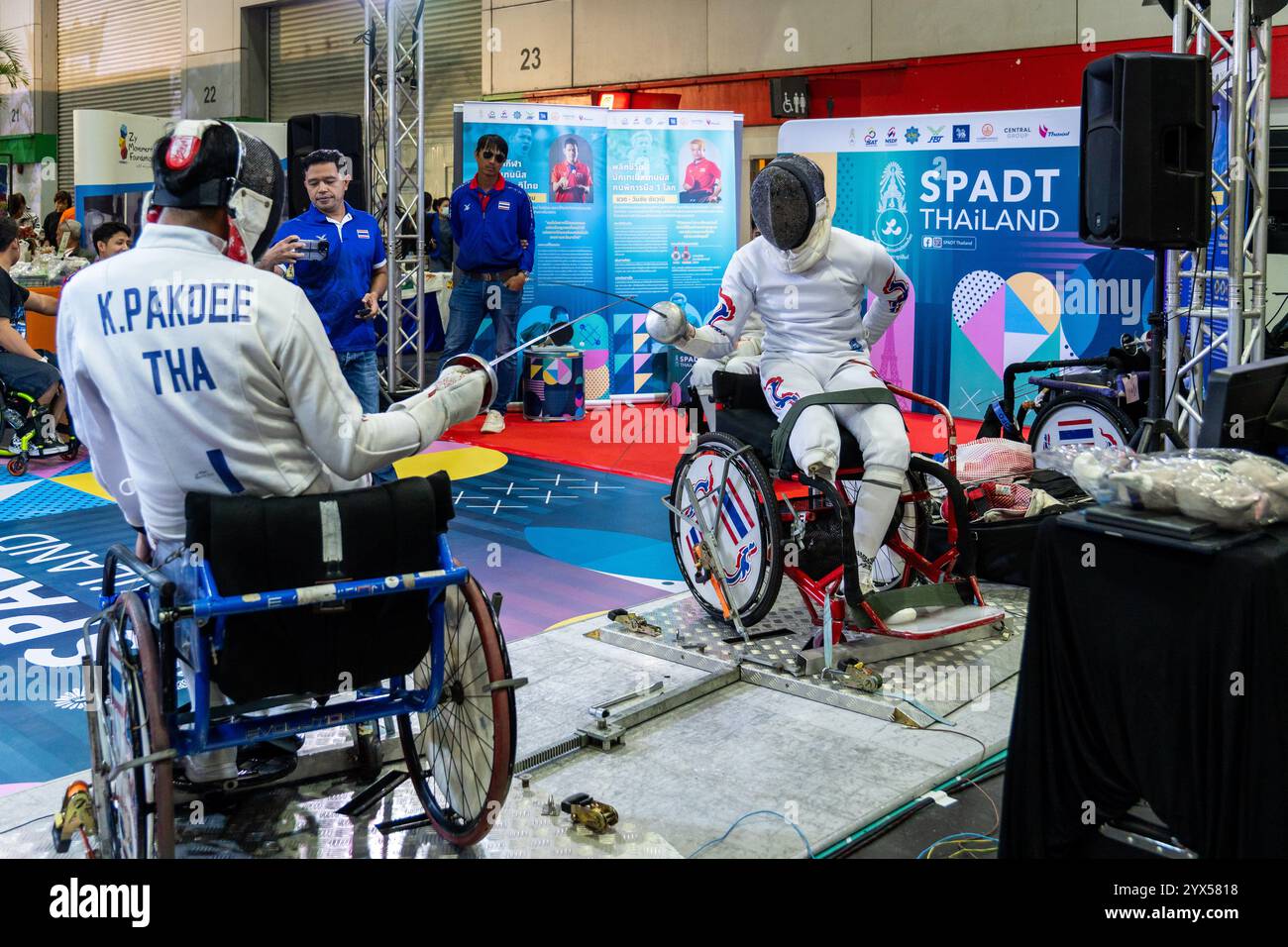 A view of disabled fencers in special equipment fighting from their ...