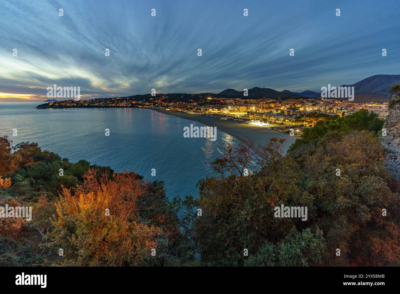 Night view of a beautifully lit, colorful city built right on the ...