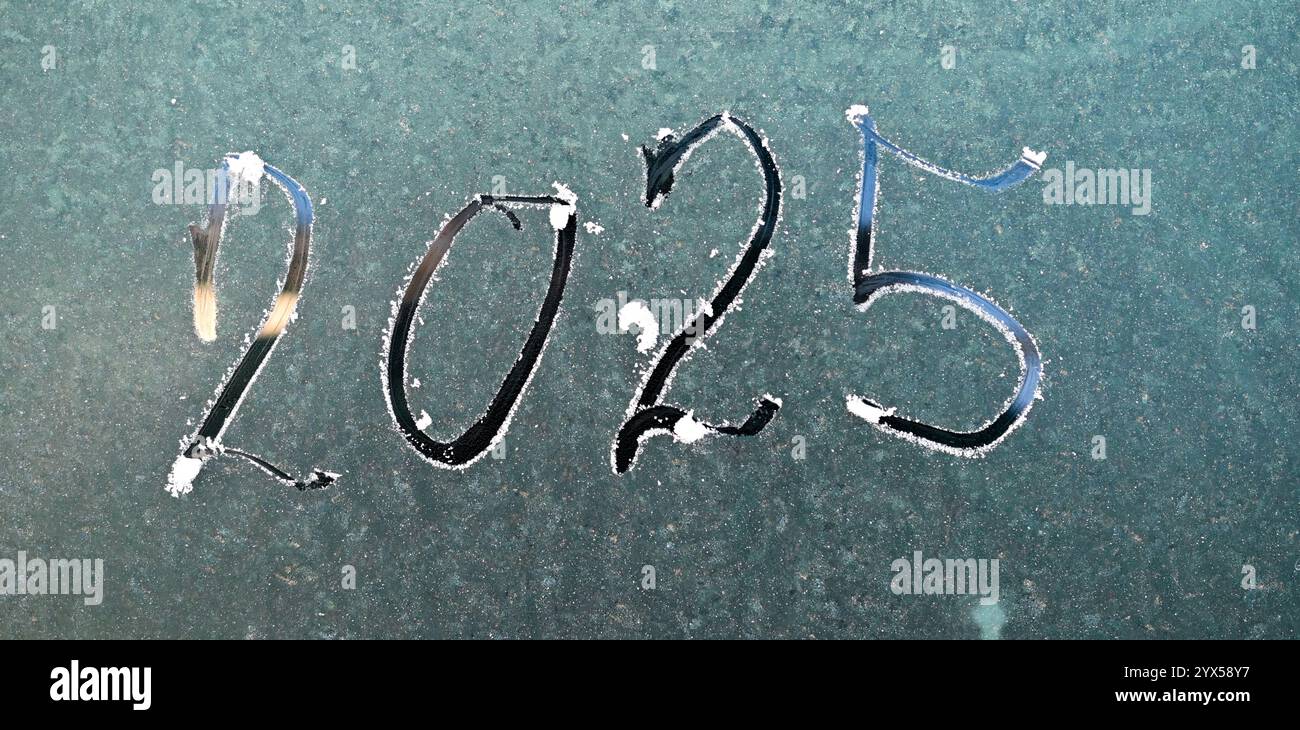 handwritten number 2025 on a frost of car window Stock Photo - Alamy