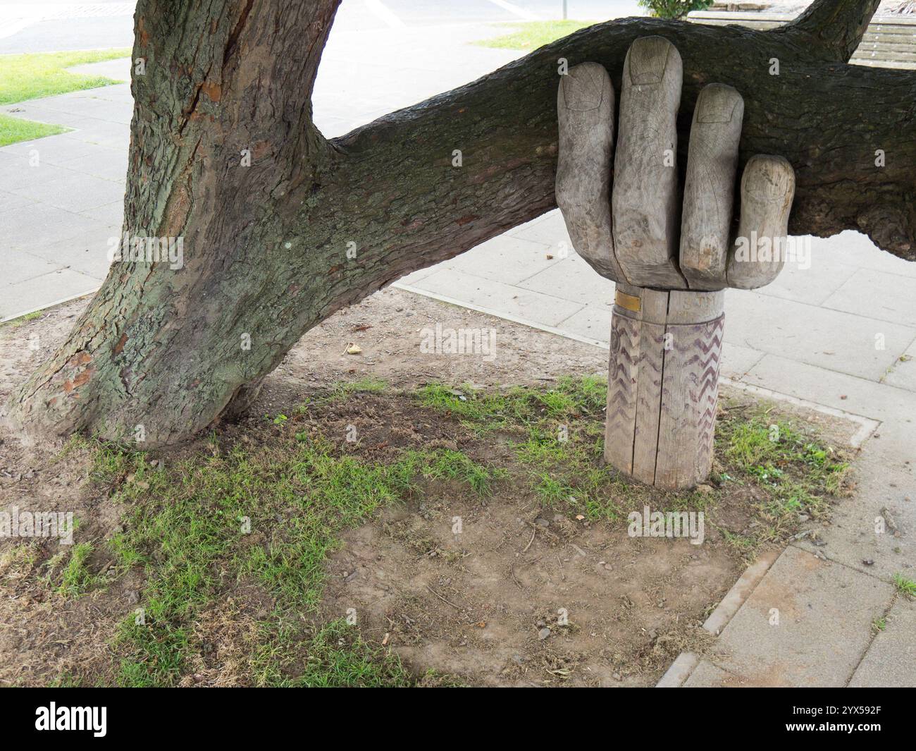 Hand sculpture is a creative artistic solution supporting a lateral ...