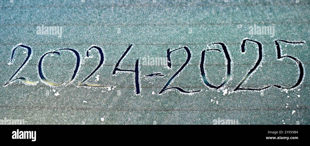 handwritten number 2025 on a frost of car window Stock Photo - Alamy