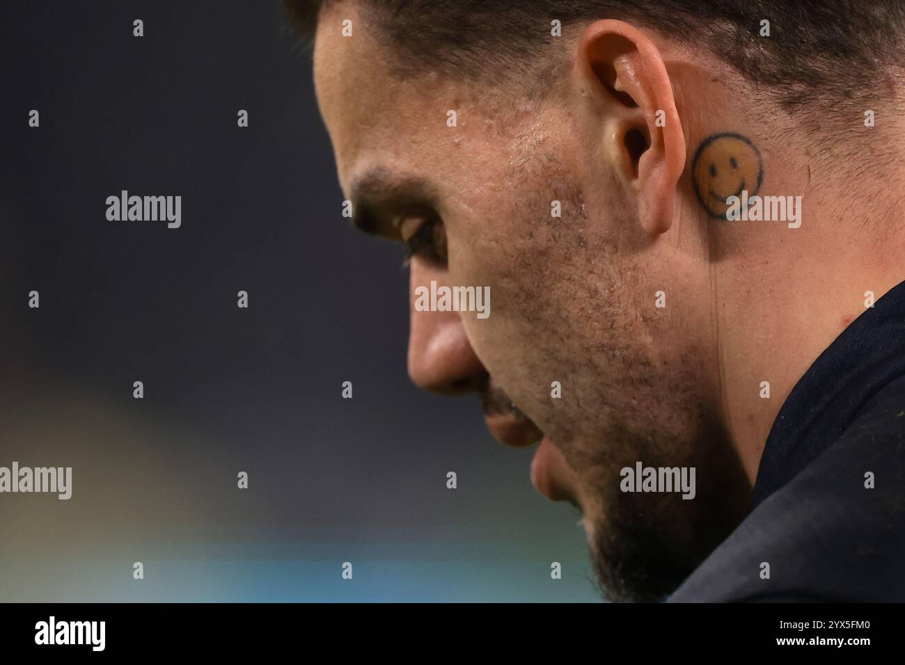 Turin, Italy. 11th Dec, 2024. A smiley tattoo is seen on the neck of ...