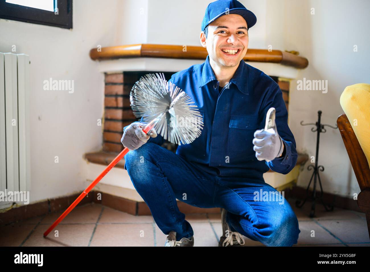 Chimney sweep happily cleaning a fireplace, ensuring safety for ...