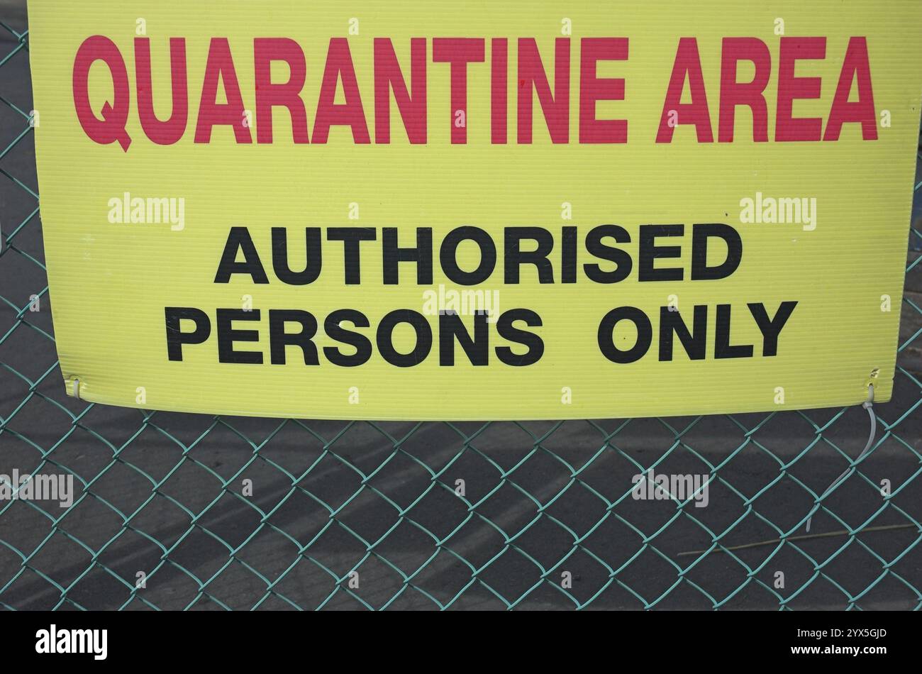 Quarantine area sign on fencing around restricted area at a port Stock ...