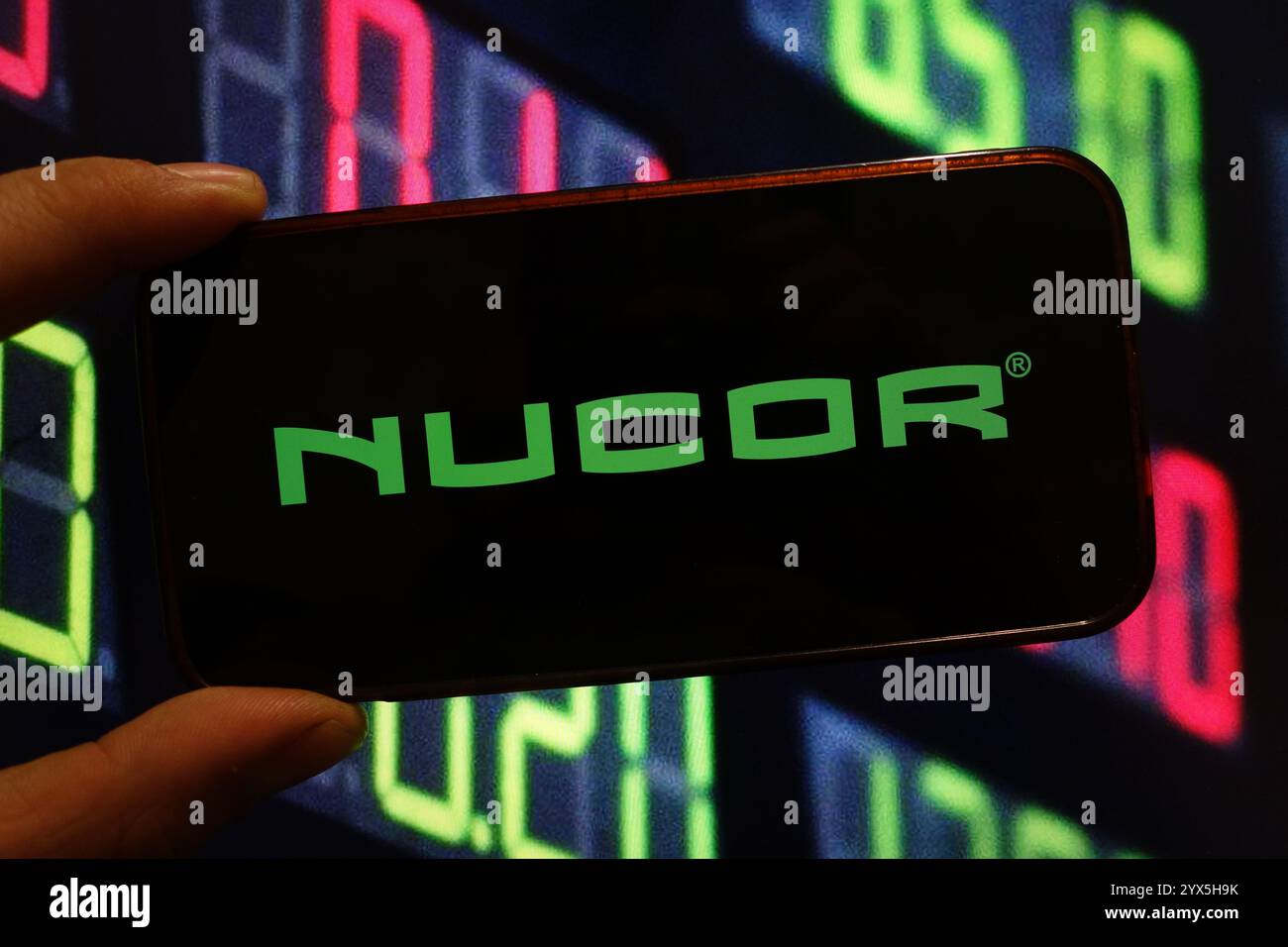 In this photo illustration, the Nucor company logo is seen displayed on ...